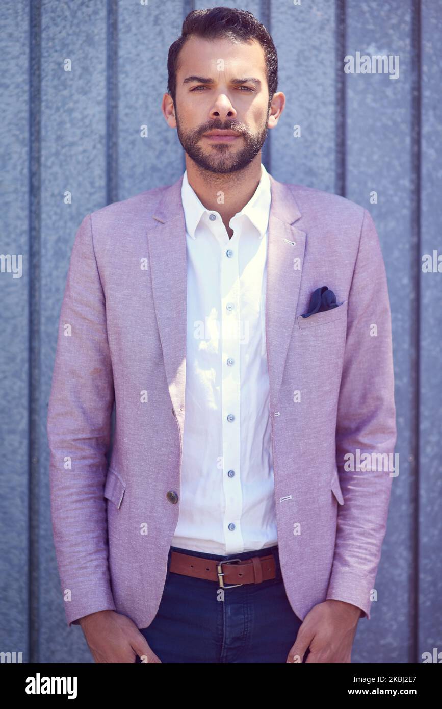 Being a gentleman never gets old. a well-dressed young man posing ...