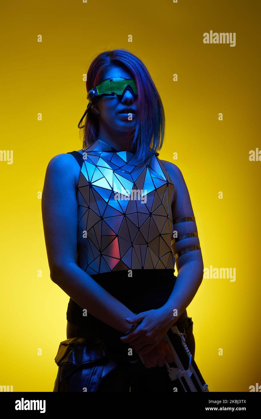 Girl with blaster in the futuristic battle. Concept virtual reality ...