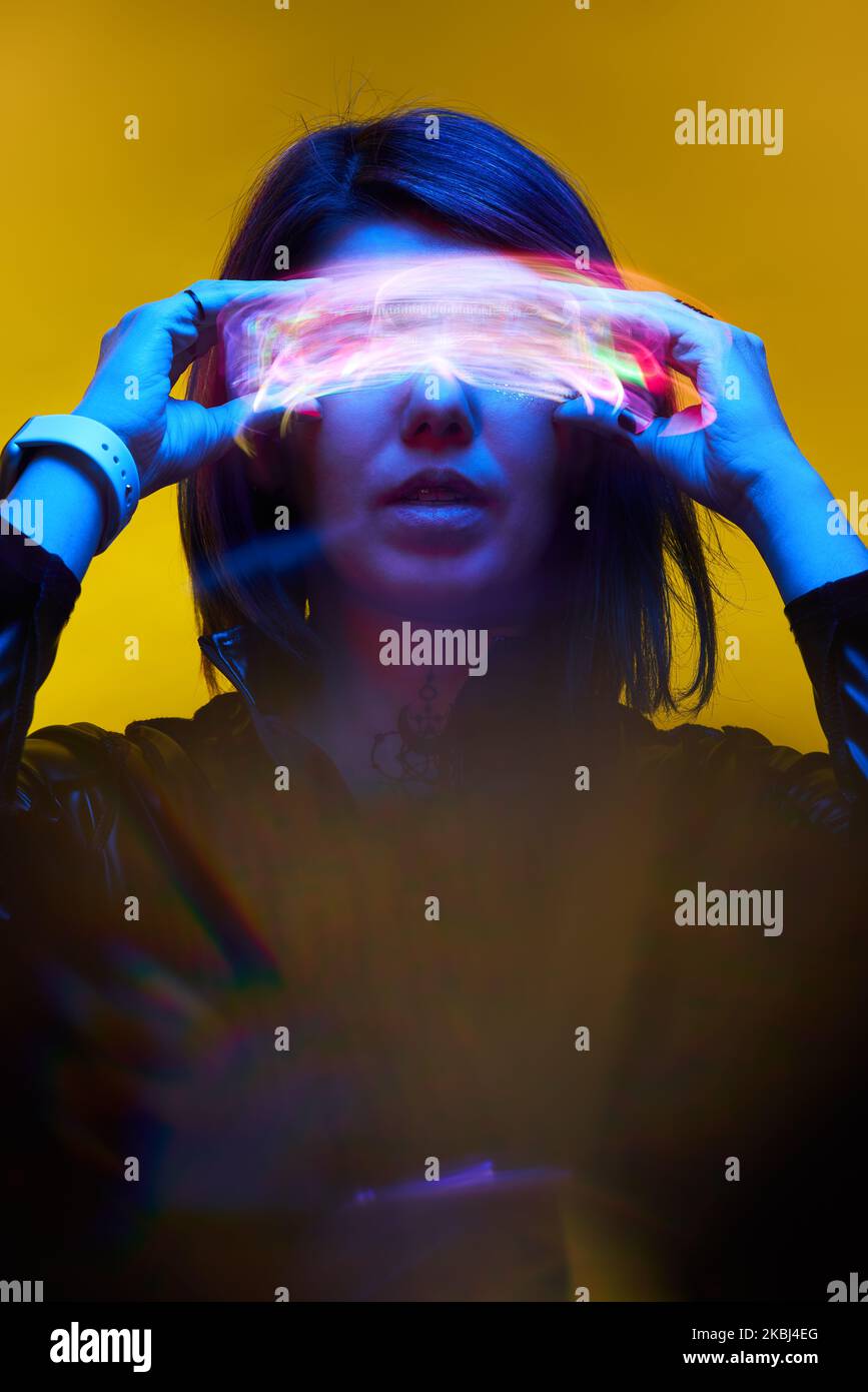 Woman is using augmented reality headset. Concept of virtual, augmented ...