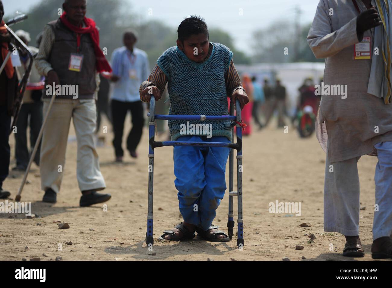 A handicapped man returns after listening the speech of Indian Prime ...