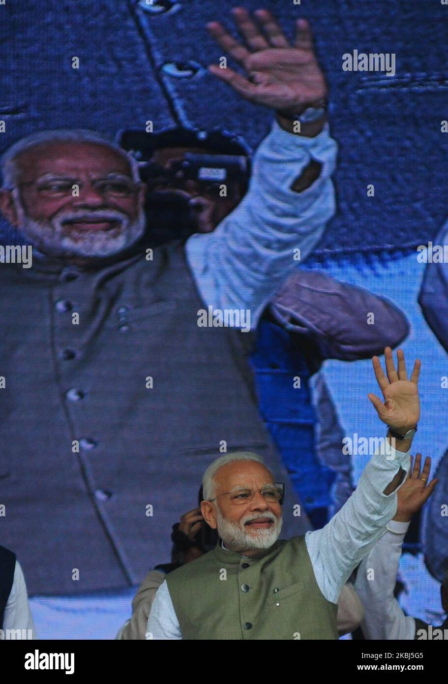 indian prime minister Narendra Modi waves as he arrives to distribute ...