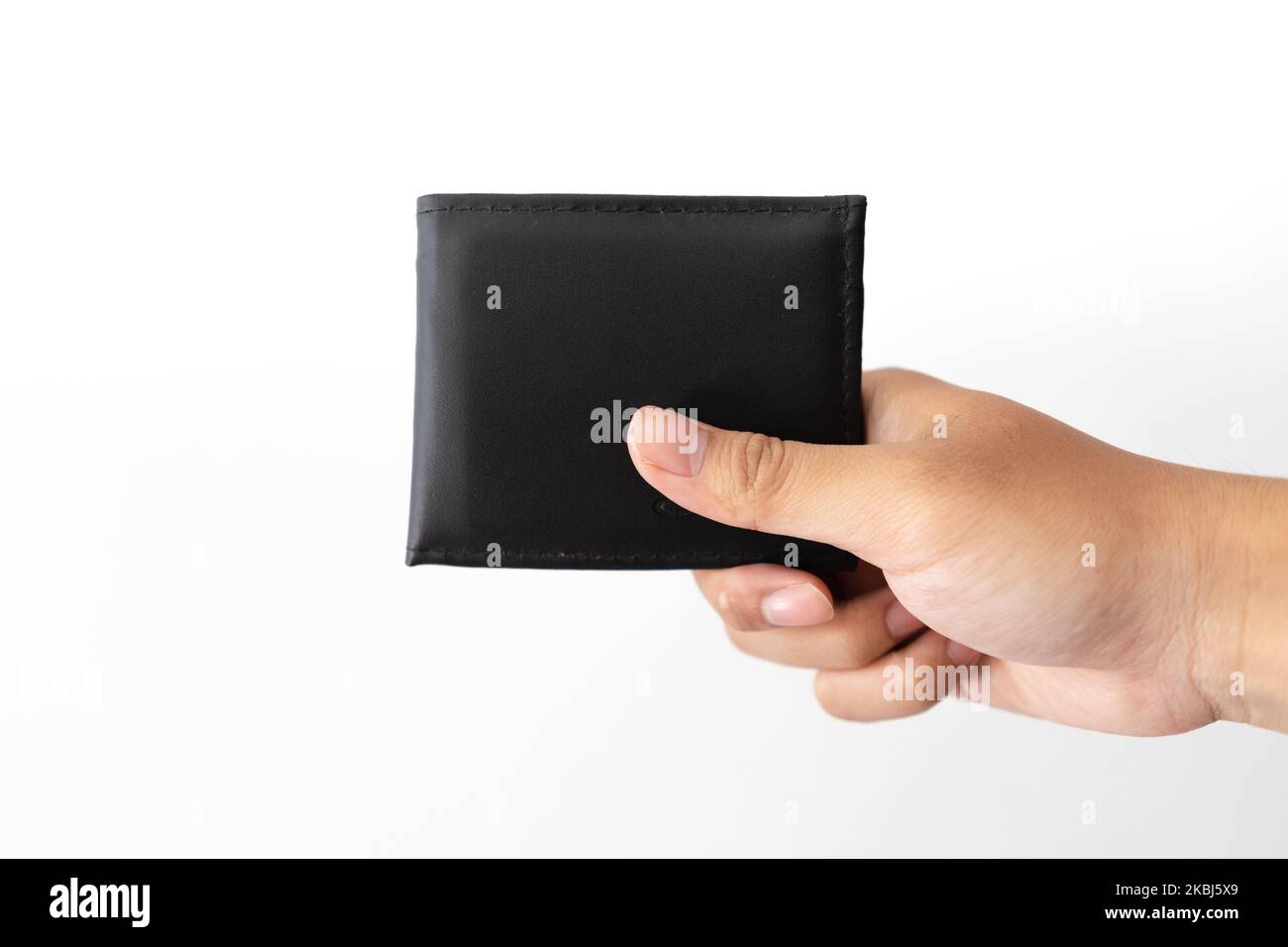Hands hold a black empty wallet with no money inside Stock Photo - Alamy