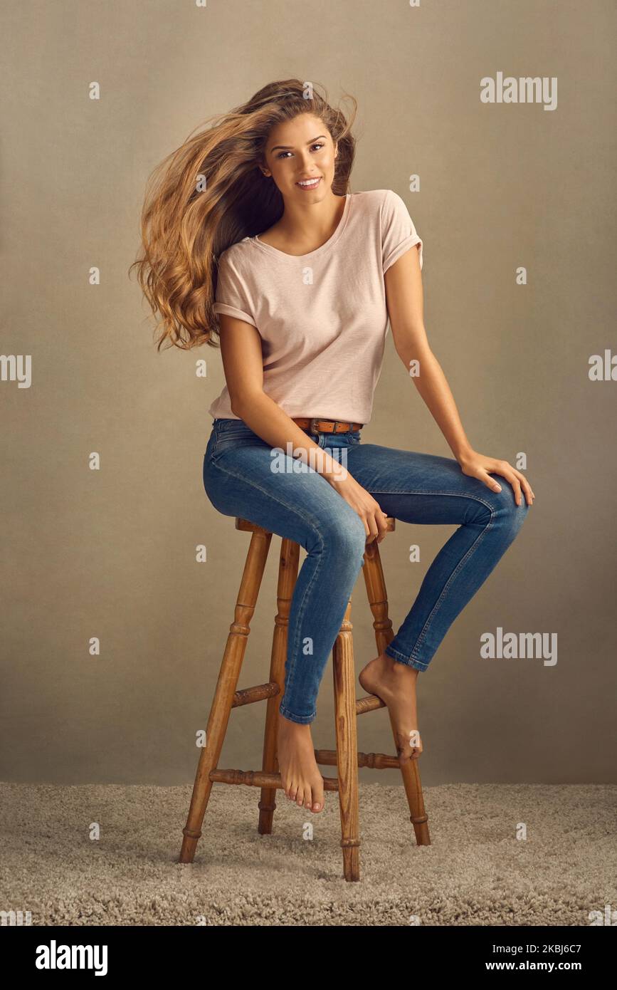Girls, you should be smiling. Studio shot of a beautiful young woman ...