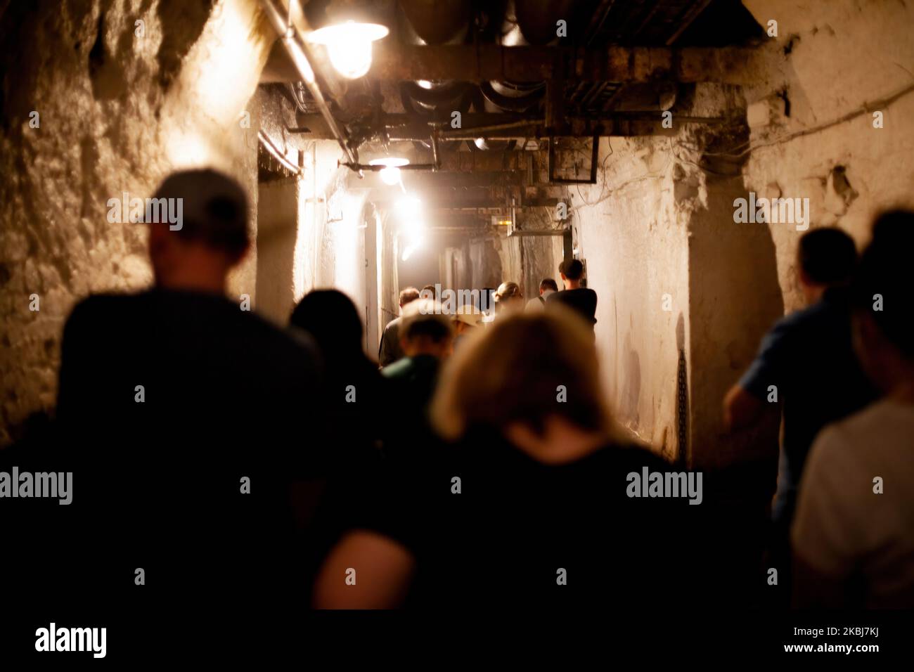 People in an underground tunnel. People go into an underground tunnel ...