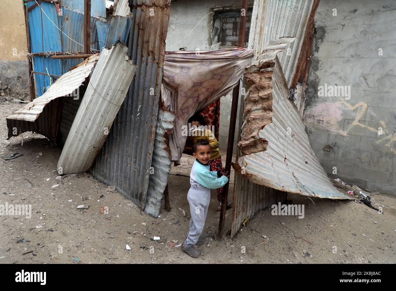 Palestinian refugees play outside their family home at al-shati ...