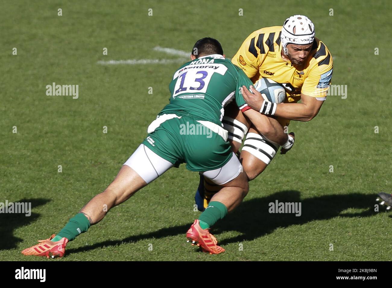 Curtis Rona of London Irish tqackling Lima Sopoaga of Wasps Rugby ...