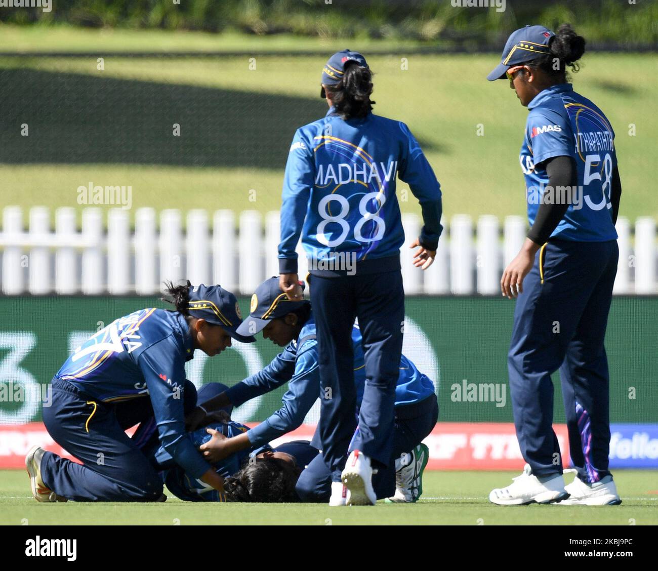 Players check up on Umasha Thimeshani of Sri Lanka after she suffered ...