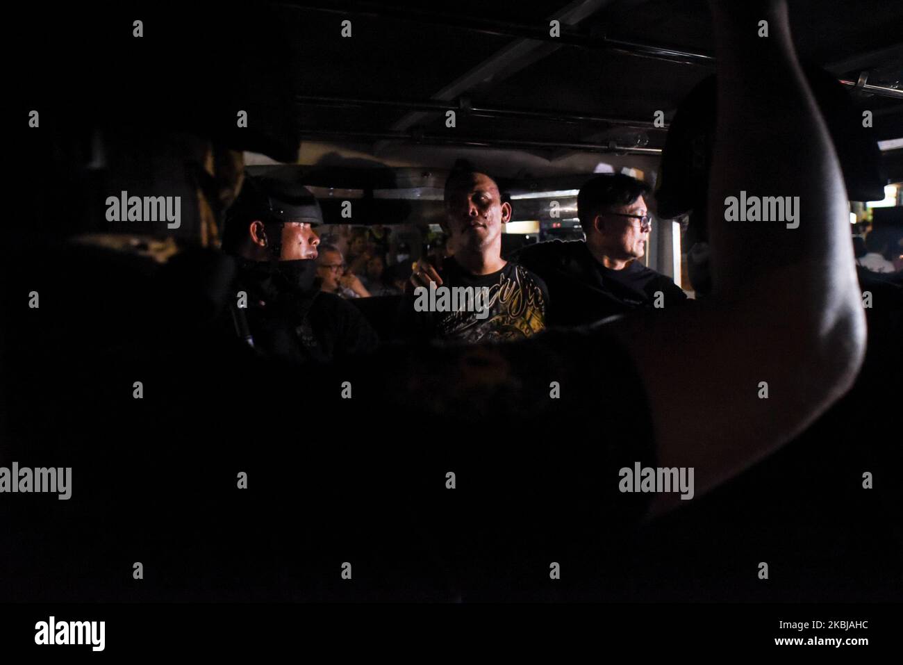 Police officers secure the suspect outside a mall in San Juan City ...