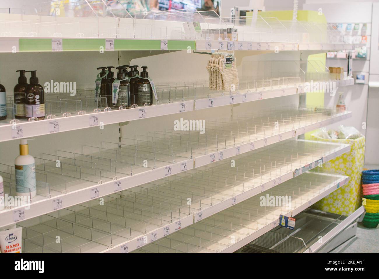 The shelfs of hygiene products are seen being empty in DM drug store in ...