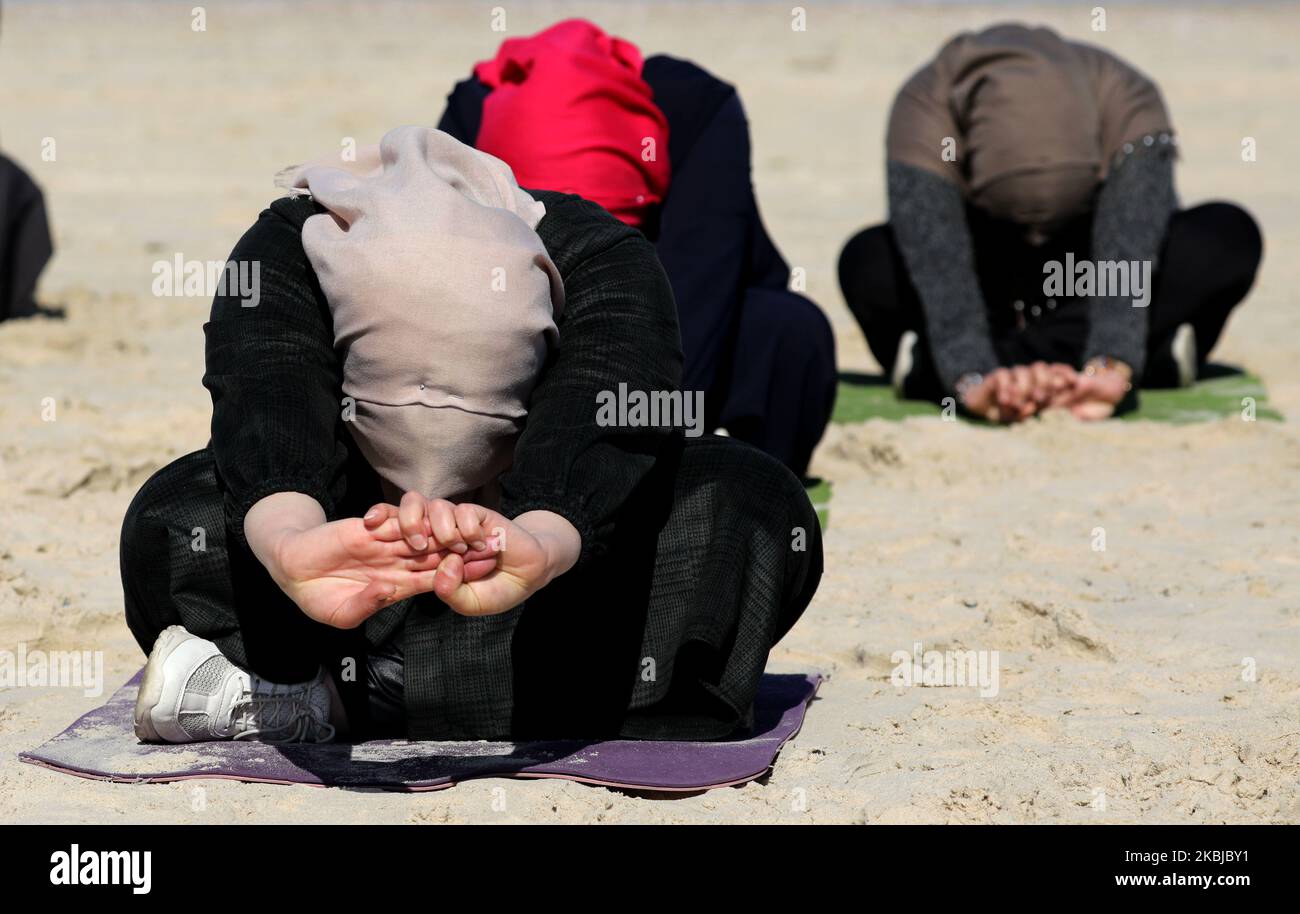 Palestinian women practise yoga on the beach in Gaza City on March 3 ...