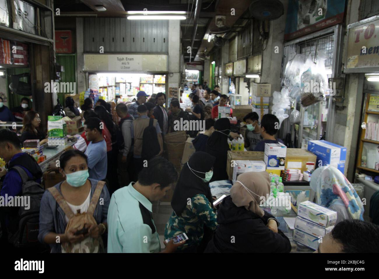 Passenger wash their hands with liquid hand sanitizer before riding a ...