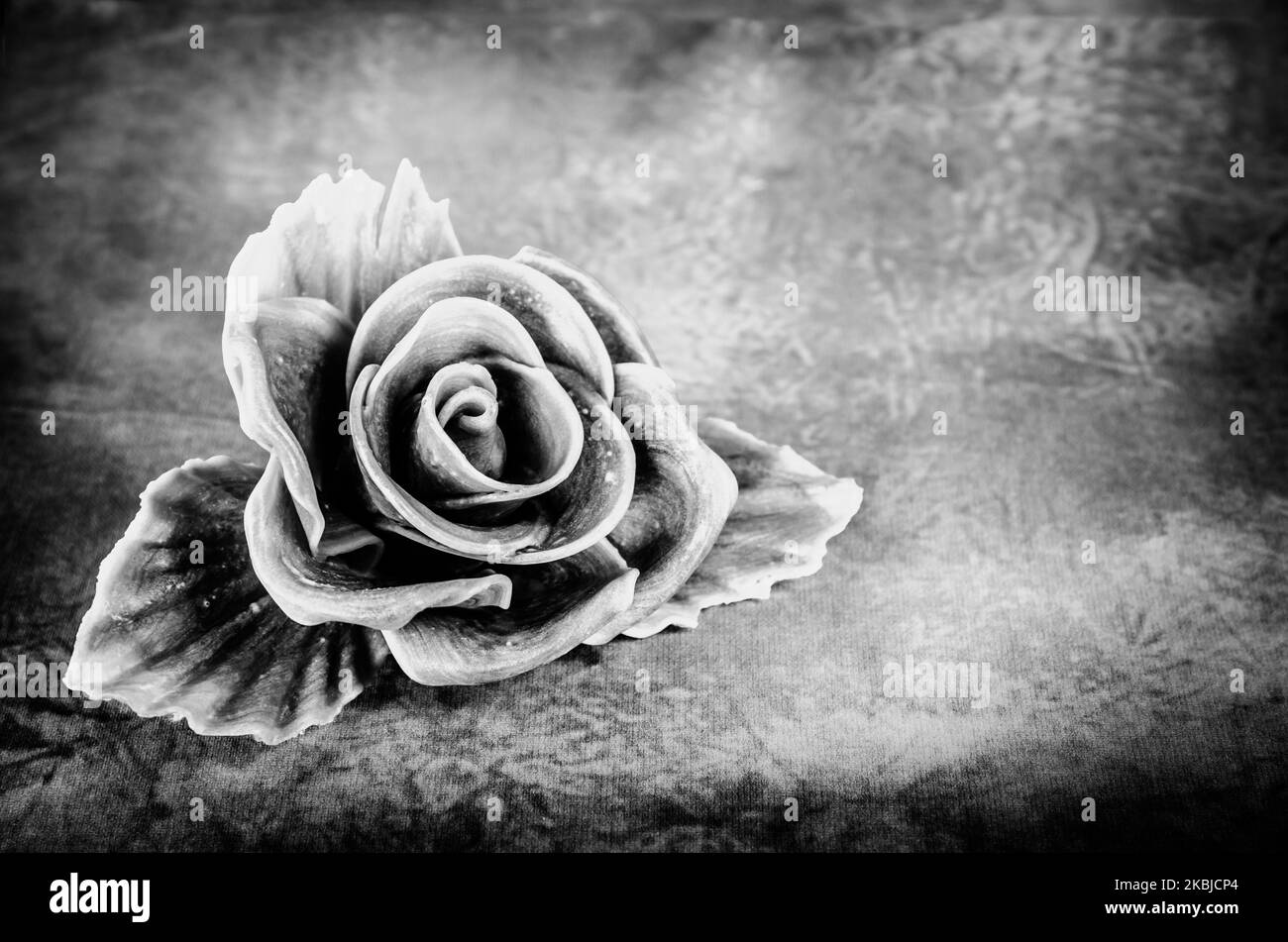 beautiful gray rose in grunge background Stock Photo - Alamy