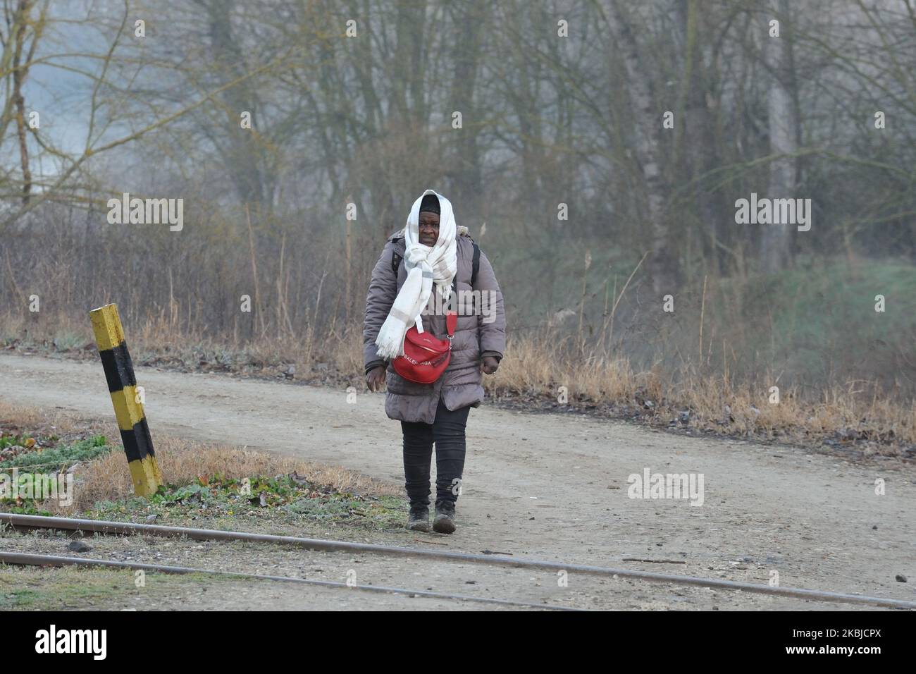 A woman from Cameroon is apprehended by Greek army patrol as she ...
