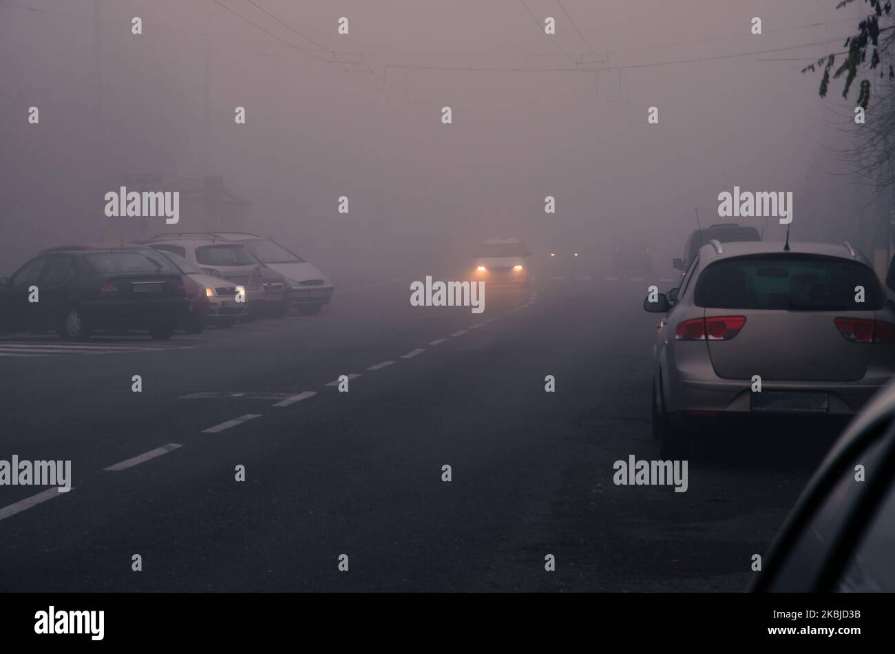 cars on road in foggy weather Stock Photo - Alamy