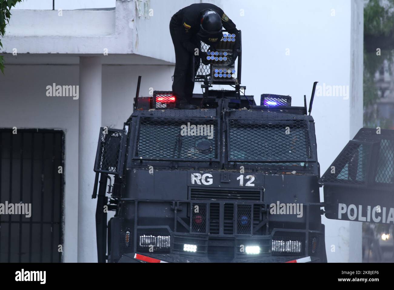A riot squad officer, esmad in the tank during the riots at the ...