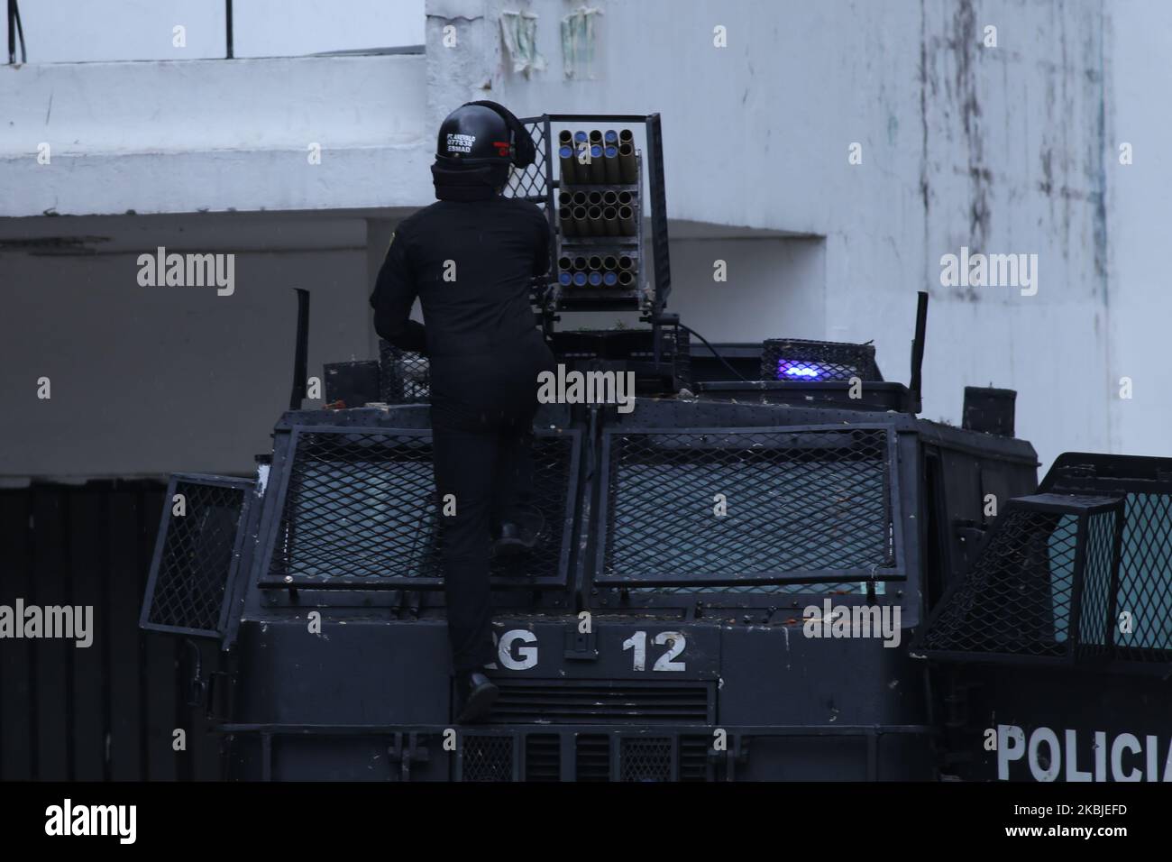 A riot squad officer, esmad in the tank during the riots at the ...