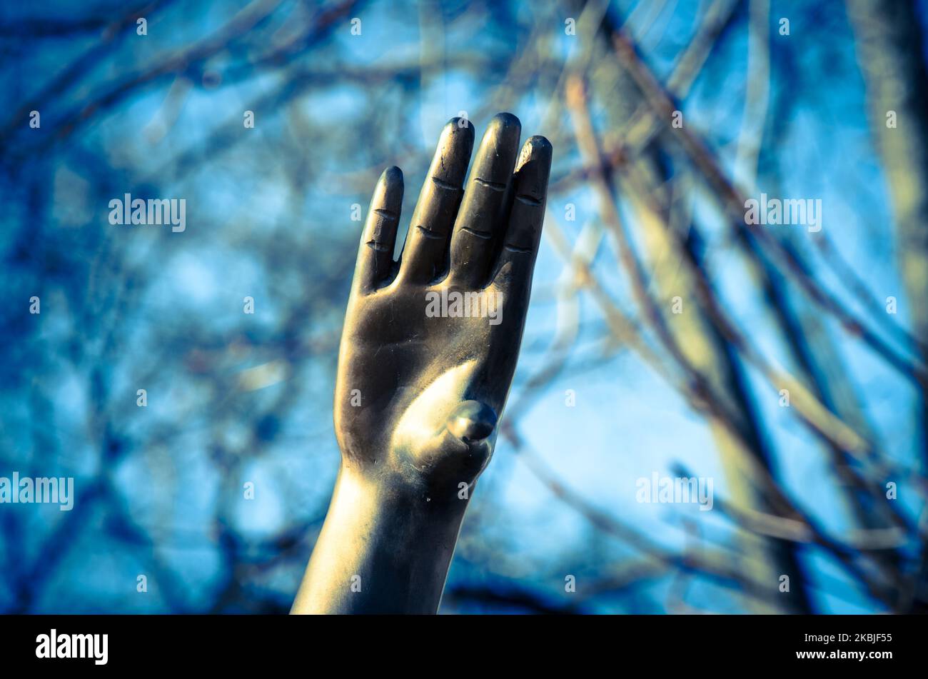 sculptured iron hand reaching up Stock Photo - Alamy