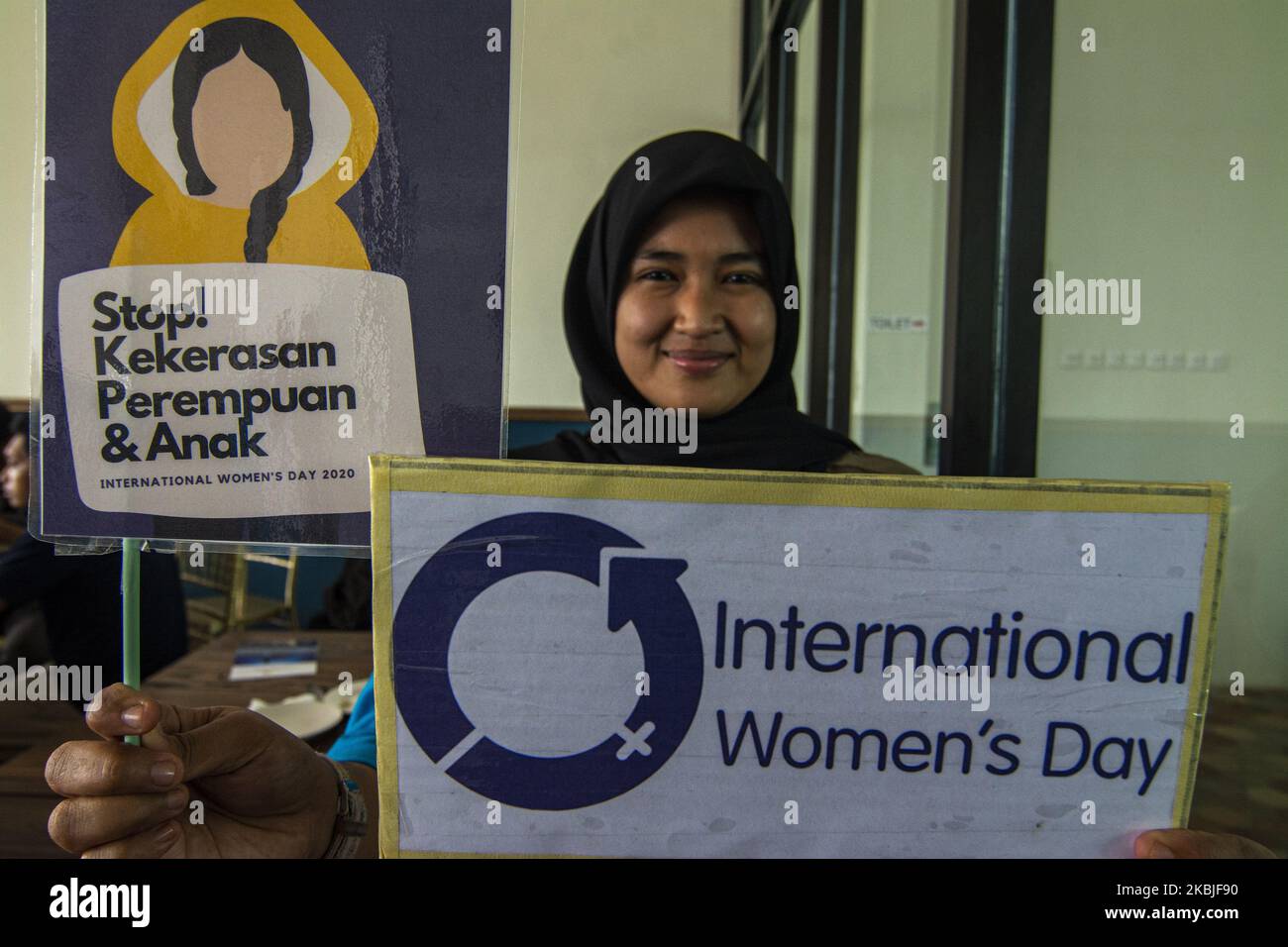 An activist from the Humanitarian Partners Network (JMK) - Oxfam brought leaflets during the ...