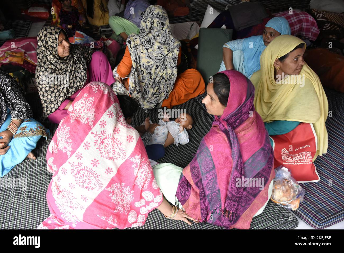Indian muslim women sit in a make shift tent where they hae taken ...