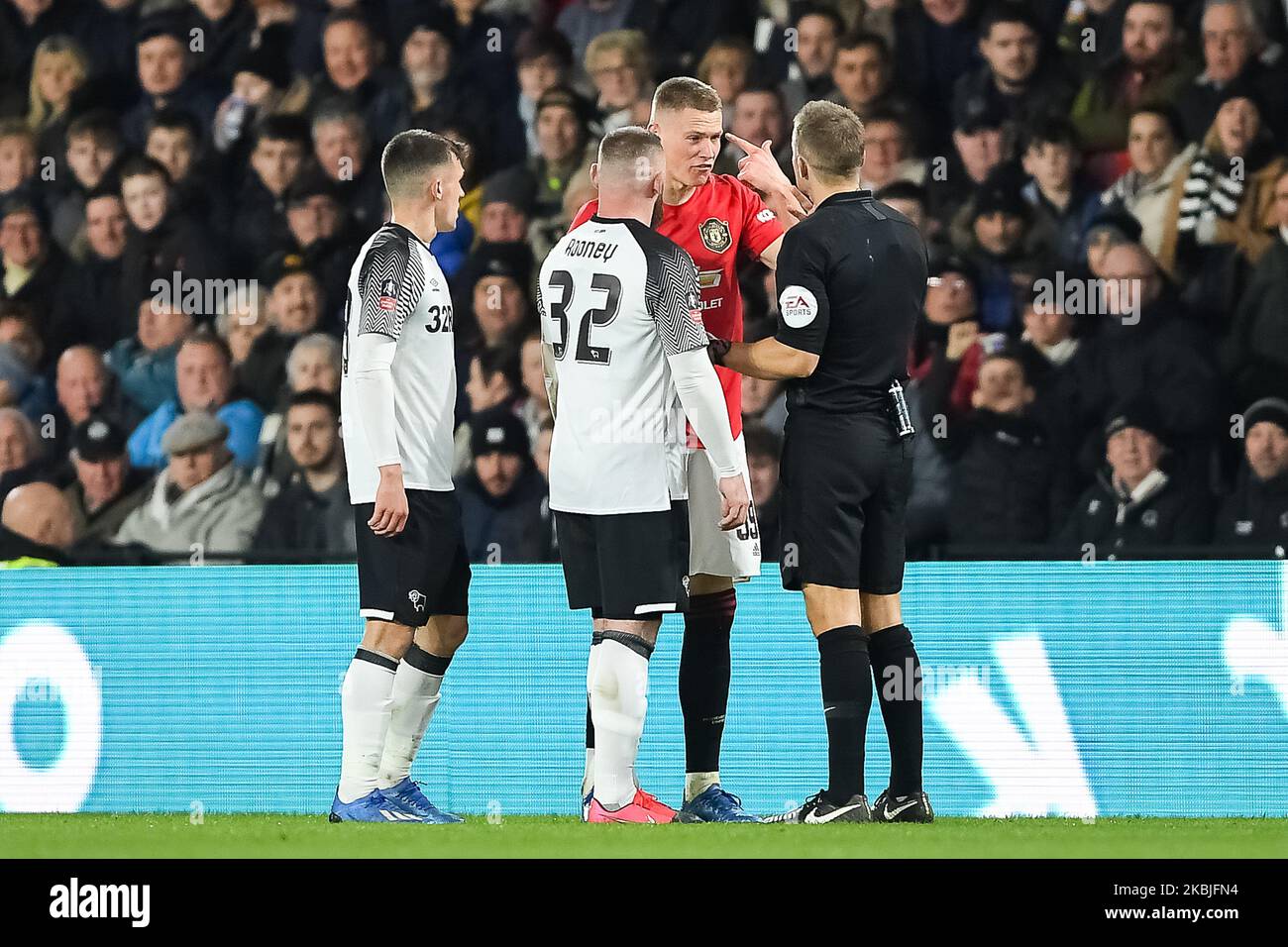 Referee Craig Pawson has words with Scott McTominay (39) of Manchester ...