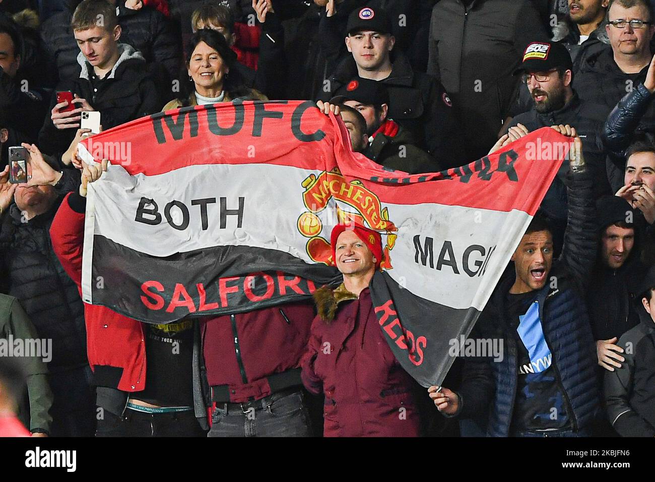 Manchester United supporters celebrate after their side scored a goal ...