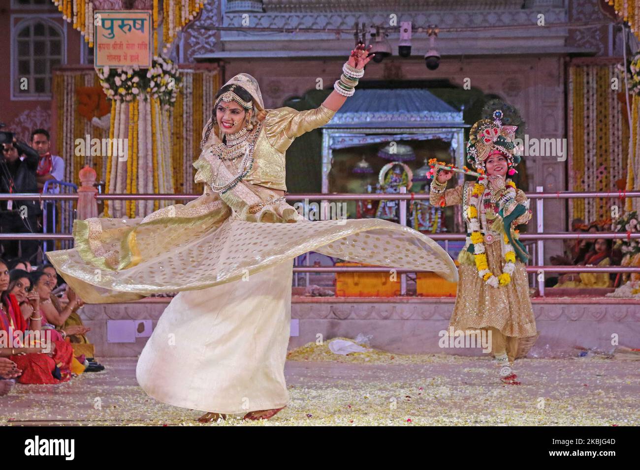 Jaipur: Artists dressed up as Lord Krishna and Goddess Radha as they ...