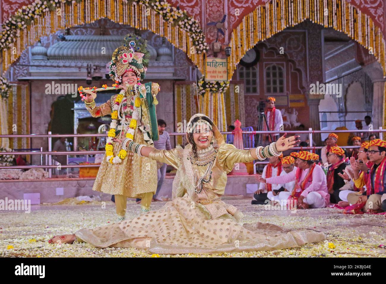 Jaipur: Artists dressed up as Lord Krishna and Goddess Radha as they ...