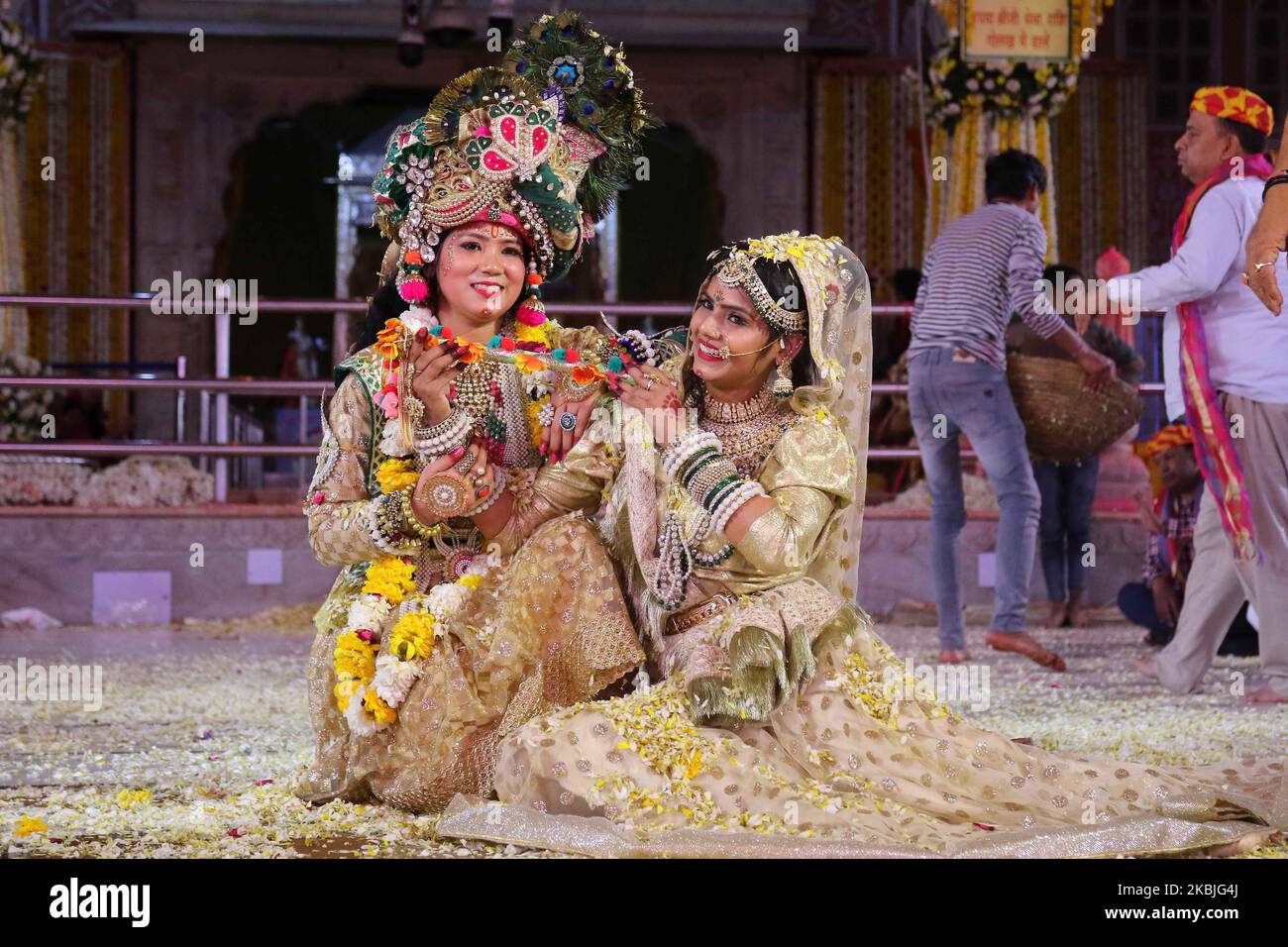 Jaipur: Artists dressed up as Lord Krishna and Goddess Radha as they ...