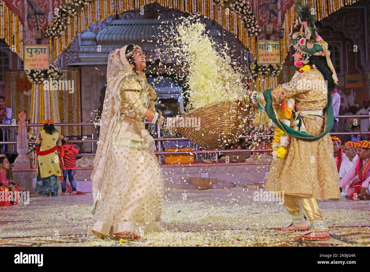 Jaipur: Artists dressed up as Lord Krishna and Goddess Radha as they ...