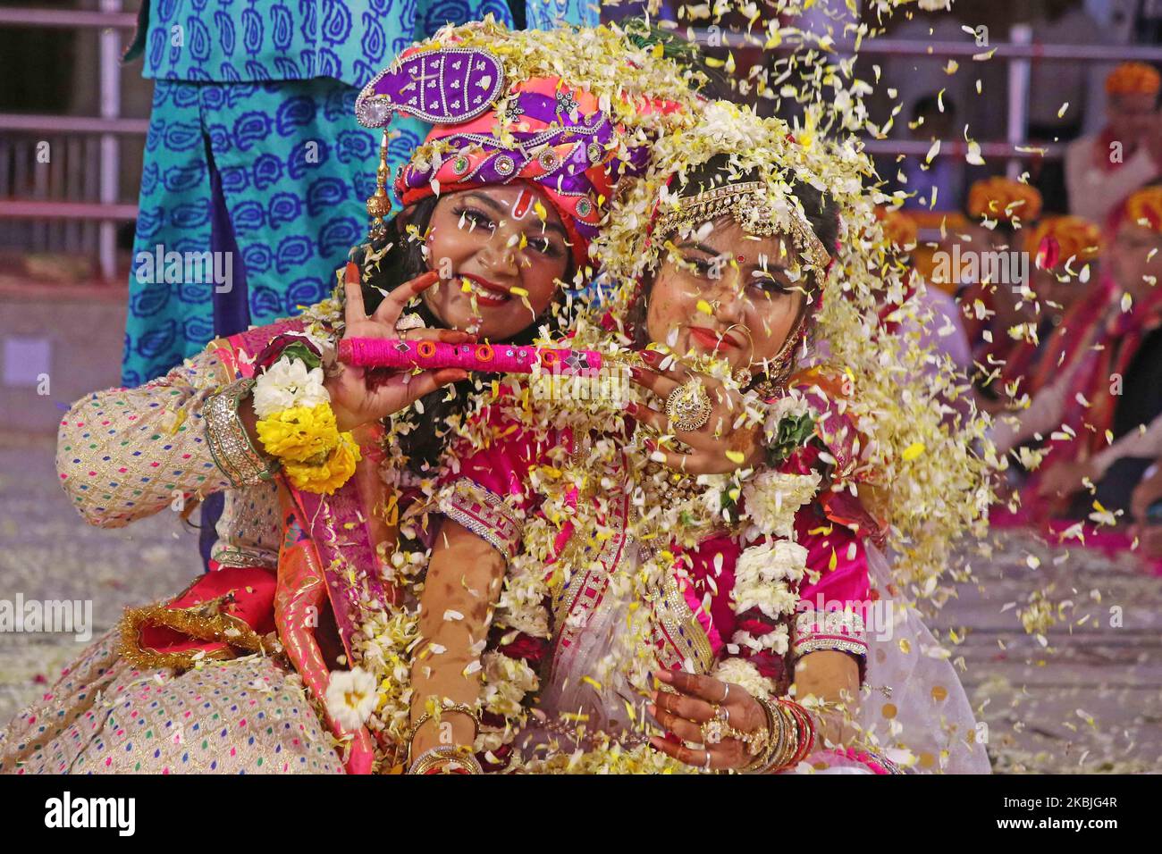 Jaipur: Artists dressed up as Lord Krishna and Goddess Radha as they ...