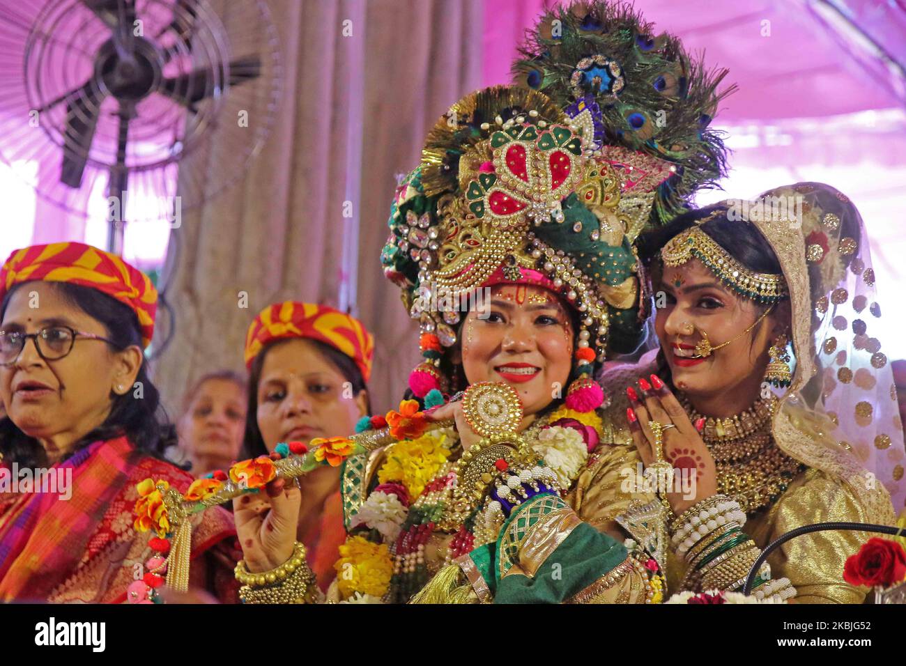 Jaipur: Artists dressed up as Lord Krishna and Goddess Radha as they ...
