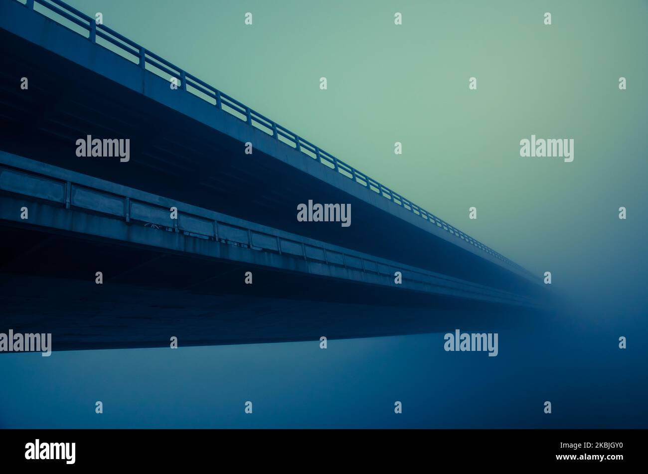 long bridge over water in fog Stock Photo - Alamy