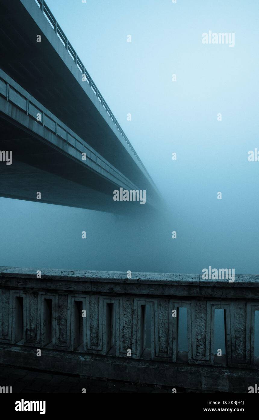 long bridge over water in fog Stock Photo - Alamy