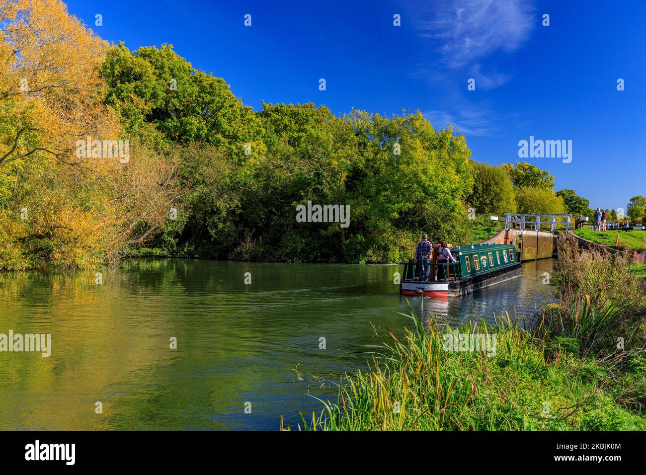A bright autumn day as a narrowboat approaches one of the 29 locks at ...