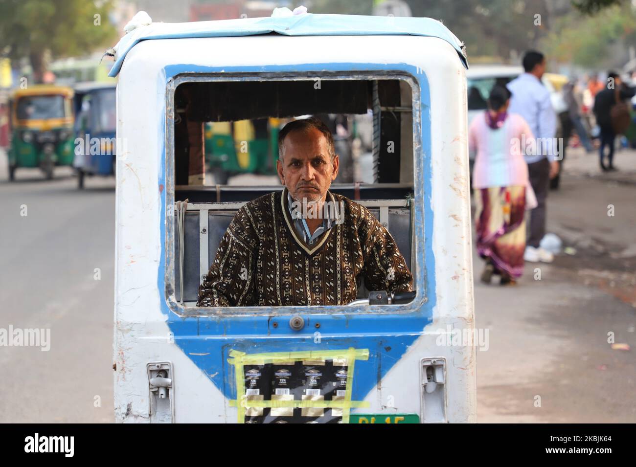 E-Rickshaw driver waits for the passengers in New Delhi India on 08 ...