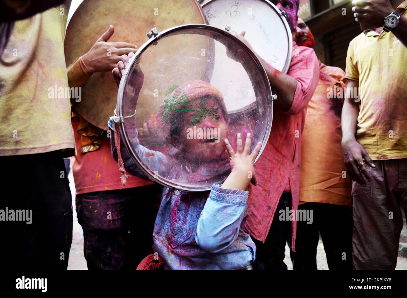 A child sees through a musical instrument while he participates during ...