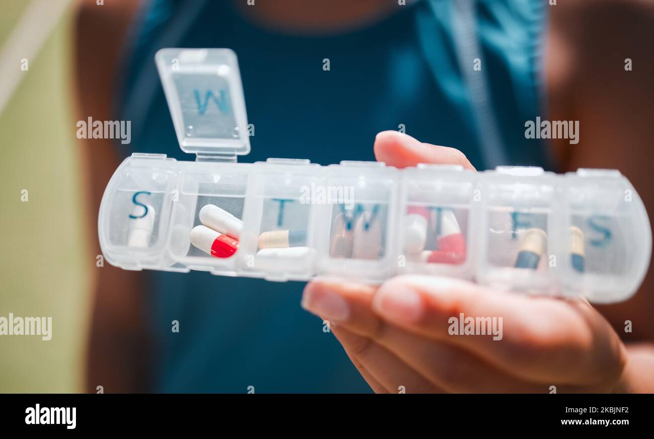 Hands, medicine and pills container schedule for health, wellness and ...