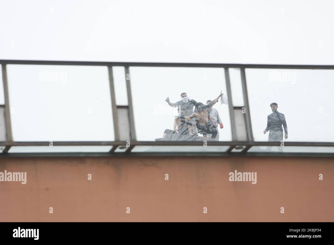 Inmates stage a protest on a rooftop of a wing at the San Vittore ...