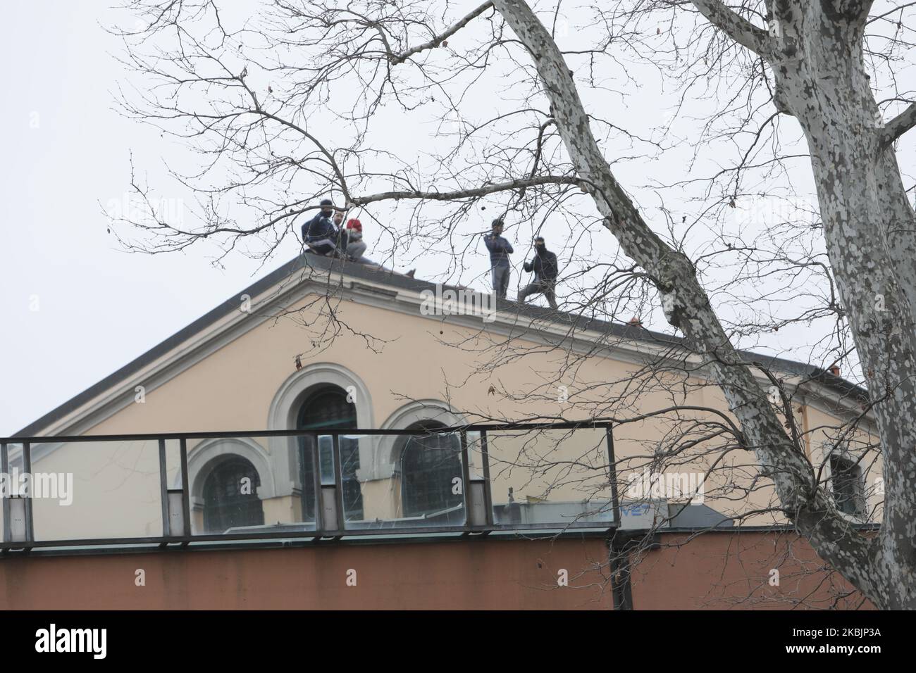 Inmates stage a protest on a rooftop of a wing at the San Vittore ...