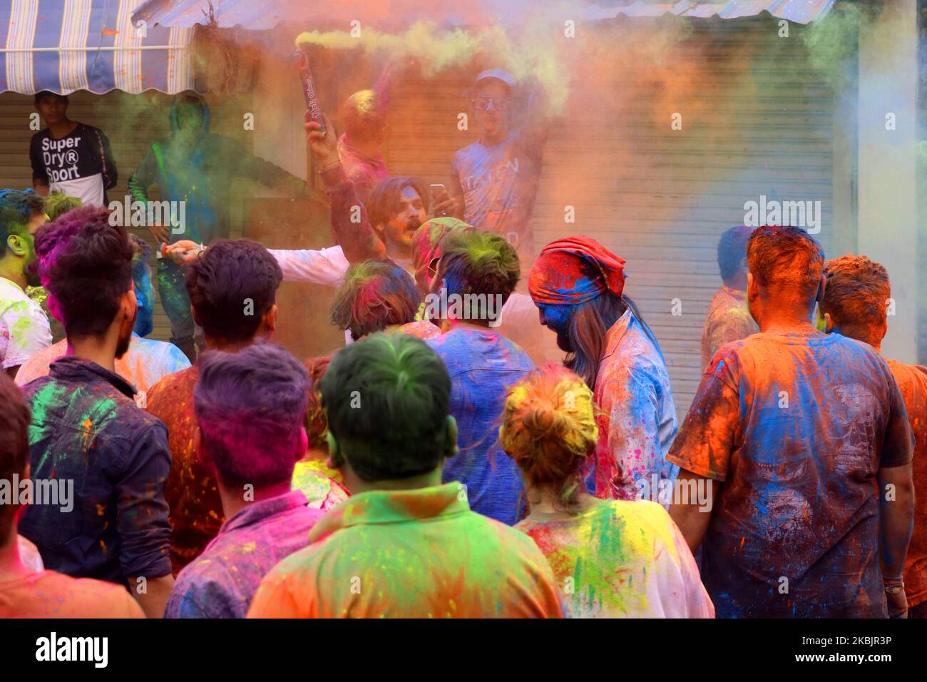 Hindu Devotees and Foreign tourist smeared in colour powder celebrates ...