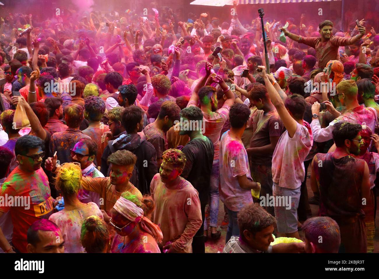 Hindu Devotees and Foreign tourist smeared in colour powder celebrates ...