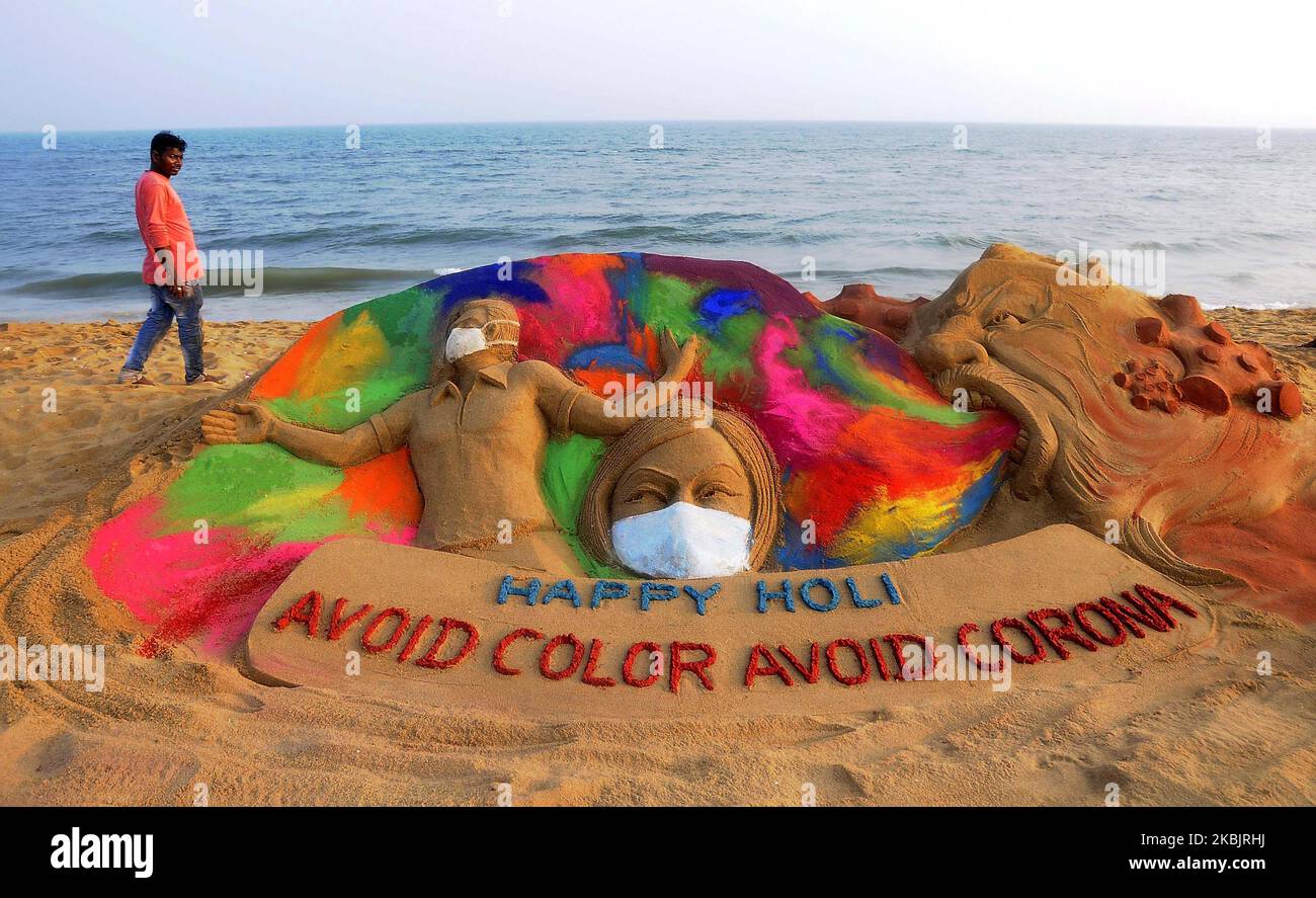 A sand sculpture about the Coronavirus and protection awareness for the ...