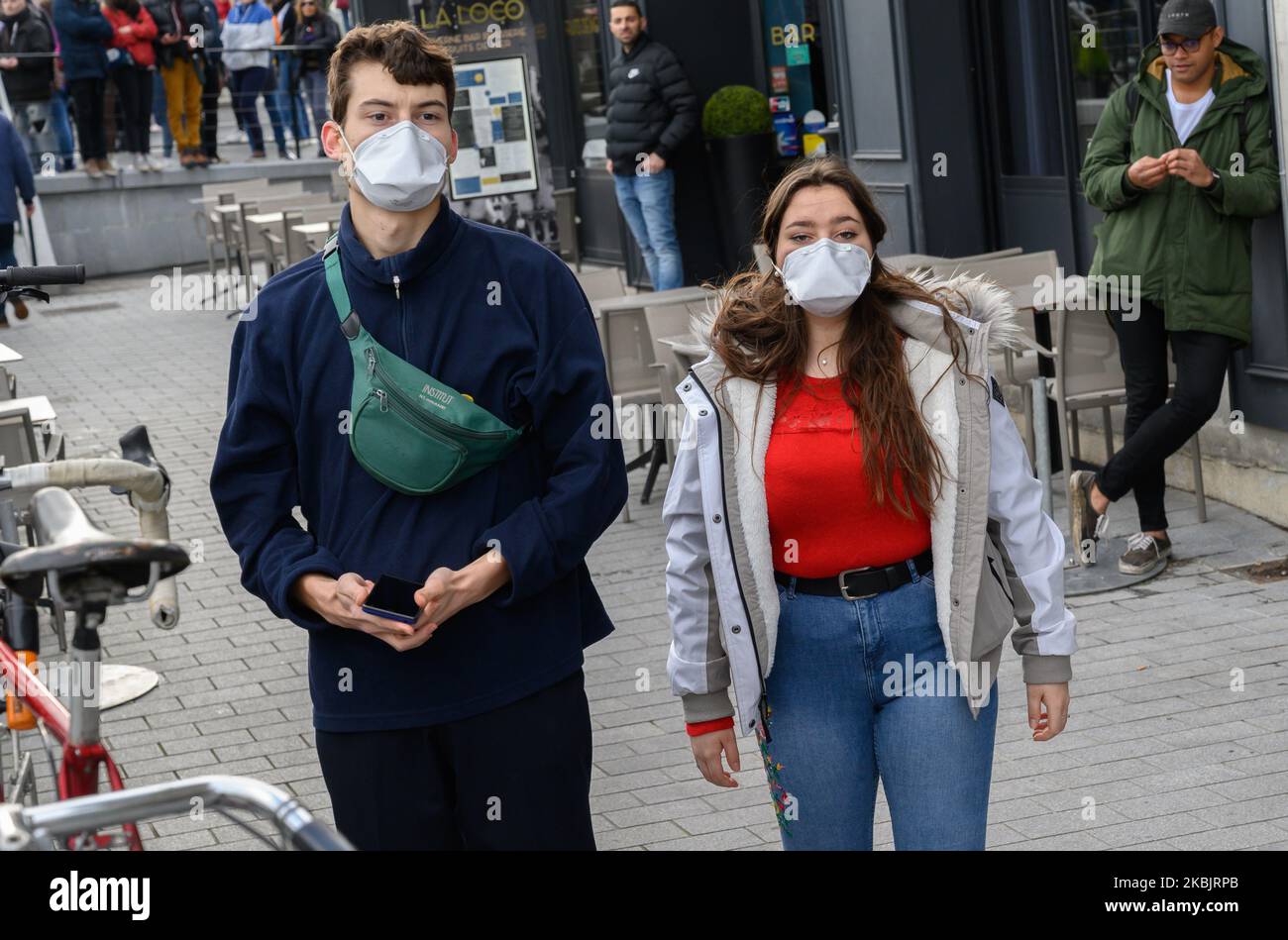 People wearing protective masks to protect themselves from Coronavirus ...