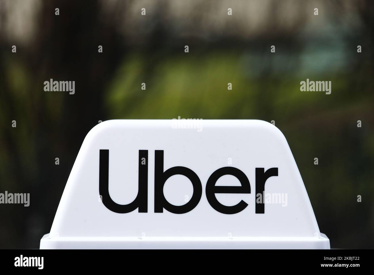 Uber sign is seen on the car in Krakow, Poland on March 10, 2020 ...