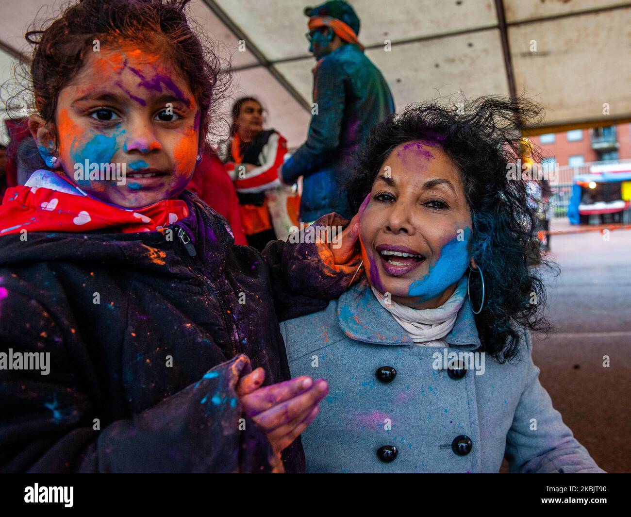 People play with colors during the Holi Festival celebration in The ...