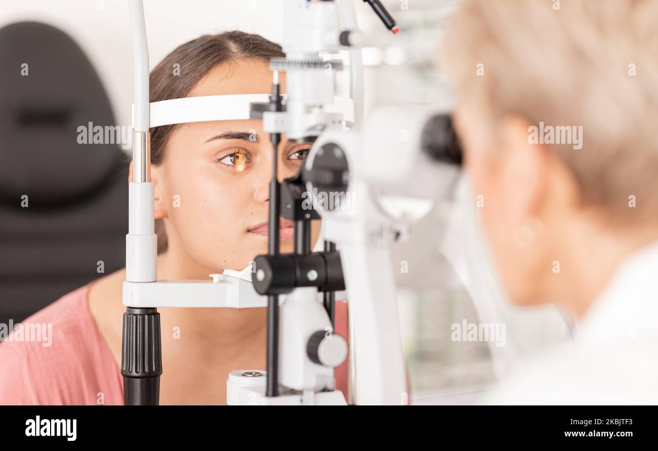 Woman at eye lens test, healthcare for vision by optician for contact ...