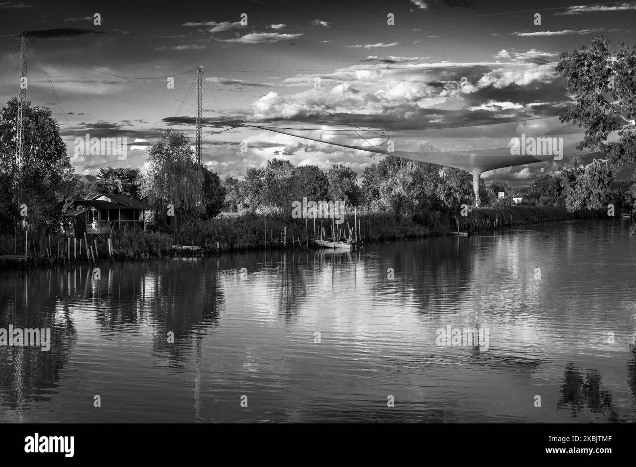 Towards the sunset. Marano lagoon late summer colors. Clouds and sun ...