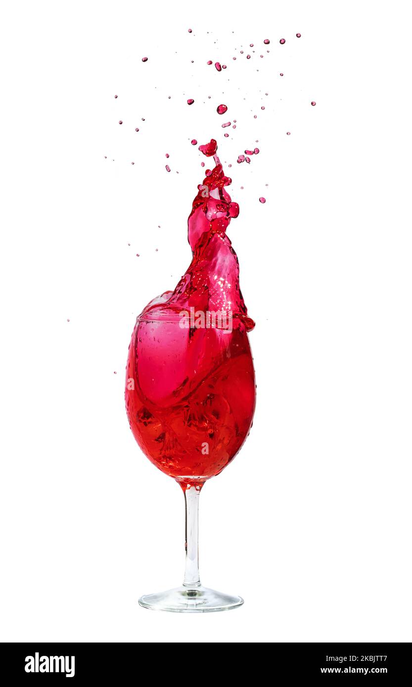 A red drink splashes from a glass, isolated on a white background Stock ...