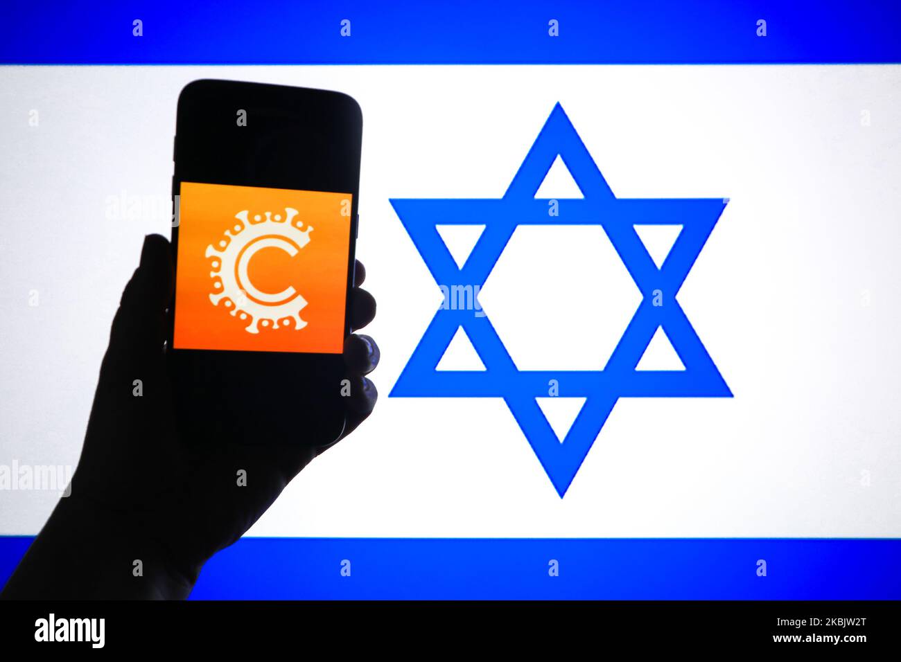 CoronApp is displayed on a mobile phone screen photographed on Israel ...