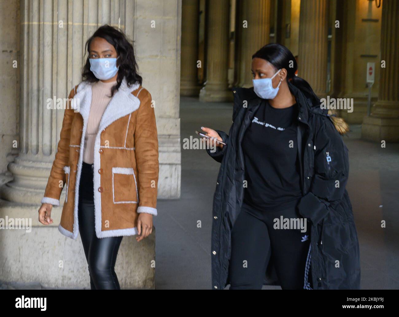 Women wearing a protective mask on the streets of Paris, France on ...